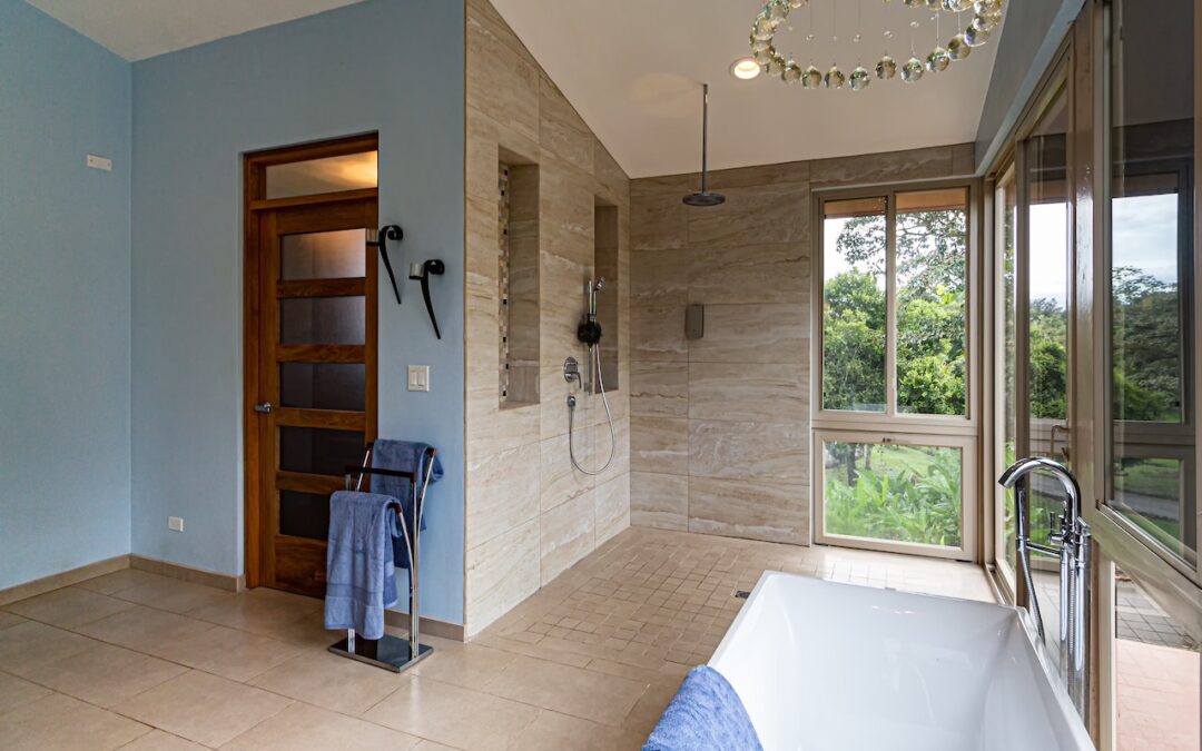 home bathroom with blue wall | Mainstream Construction Services